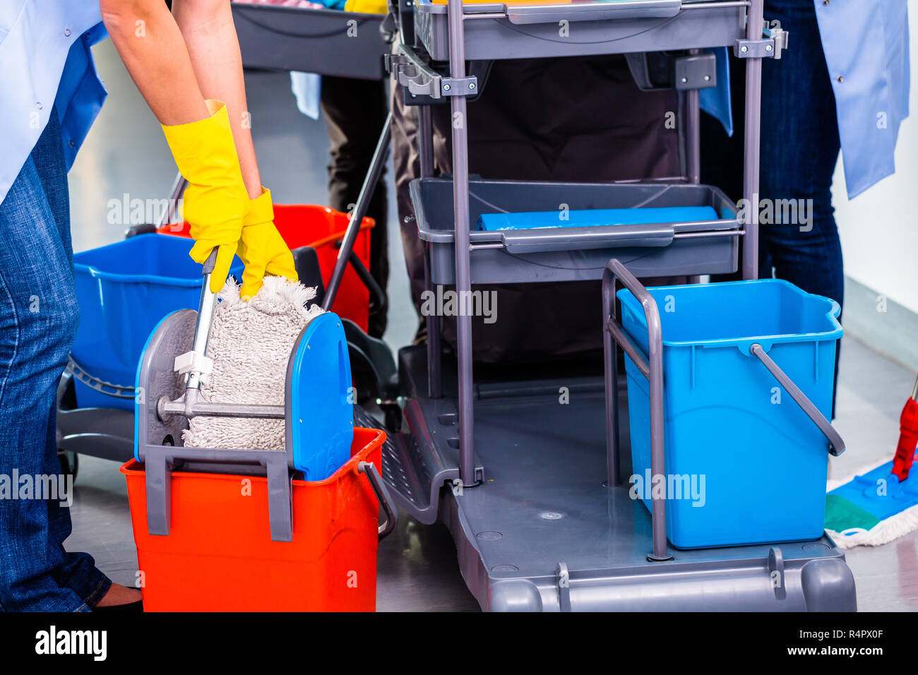 Cleaning ladies mopping floor Stock Photo - Alamy