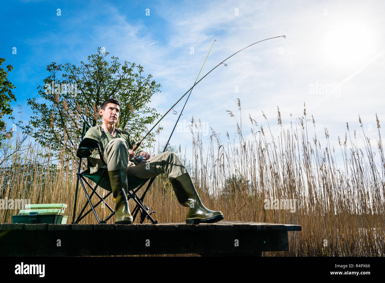 Fisherman sitting on jetty fishing hi-res stock photography and images ...