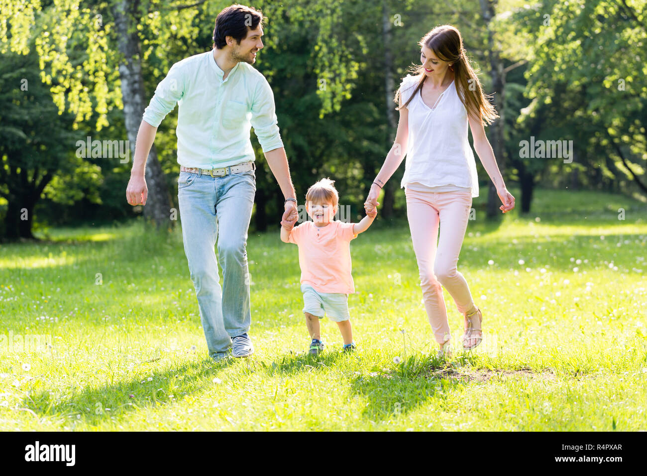 Family having walk together in summer Stock Photo - Alamy