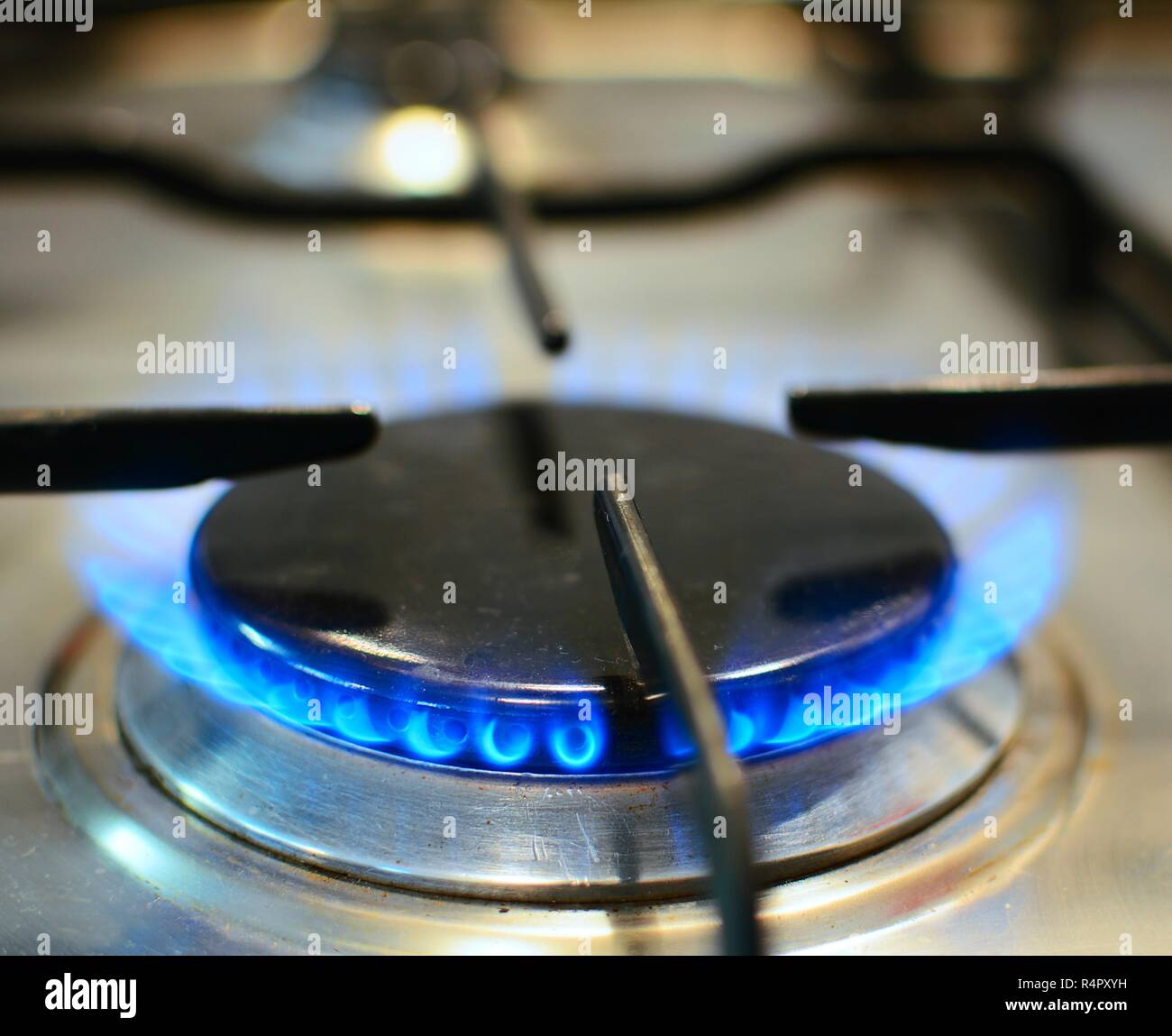 Fire on gas stove Stock Photo - Alamy