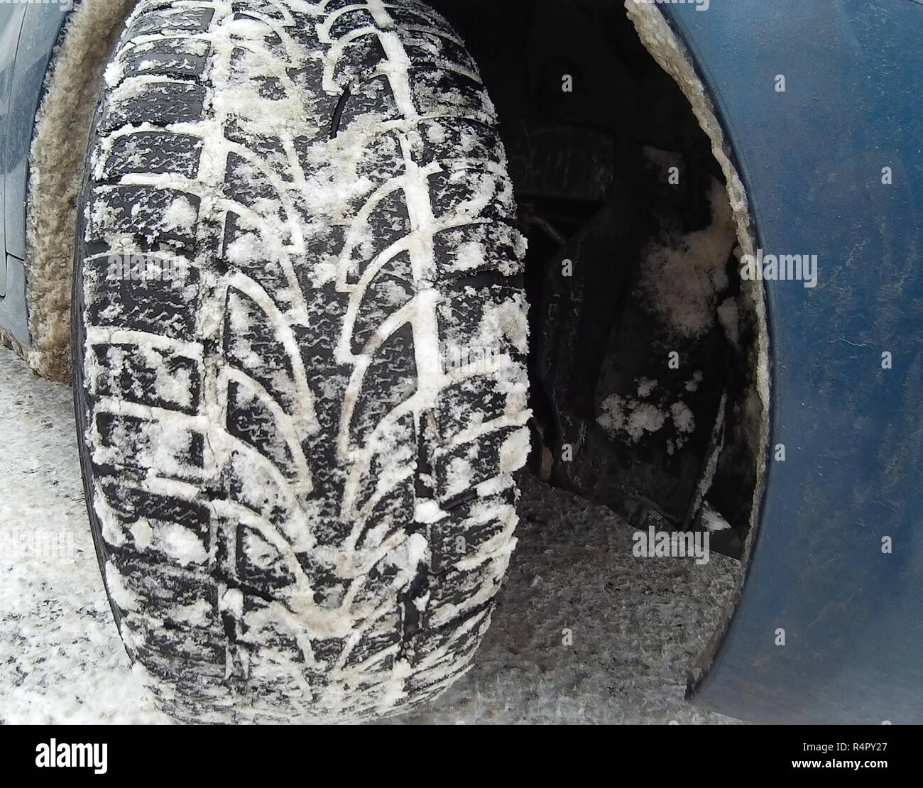Tire in snow Stock Photo - Alamy