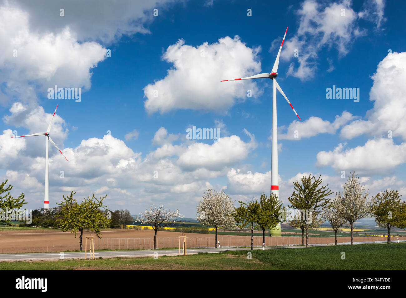 wind power plants on a country road Stock Photo - Alamy