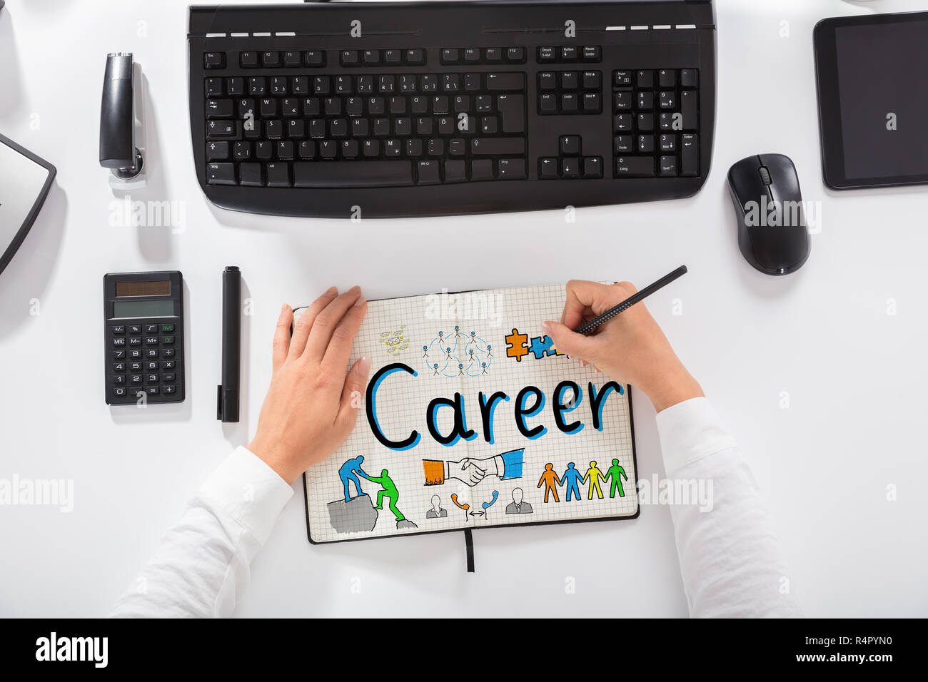Businesswoman Drawing Career Chart On Notebook Stock Photo - Alamy