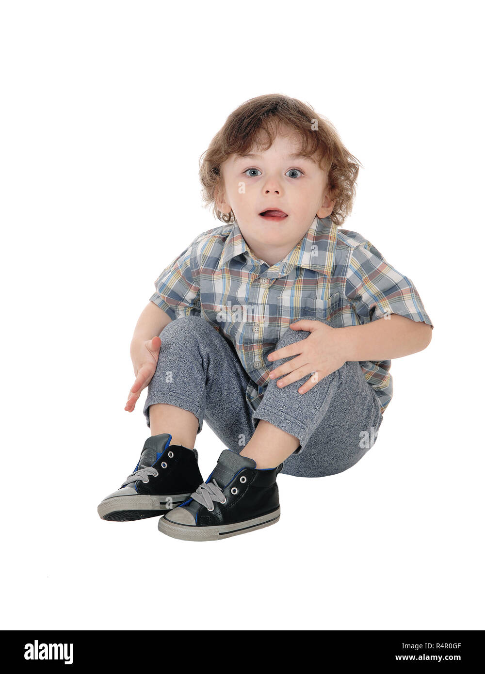 Little three year boy sitting on floor Stock Photo - Alamy