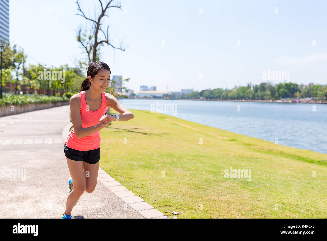 Sport woman practice running in park Stock Photo - Alamy