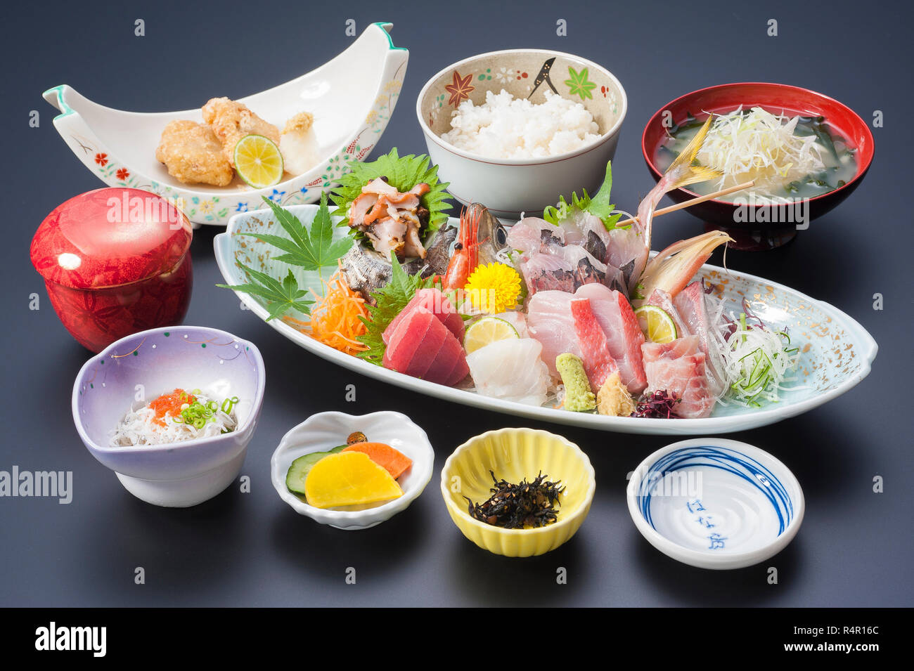 Japanese special meal with sushi tuna, shrimp, shell, fried fish, and ...