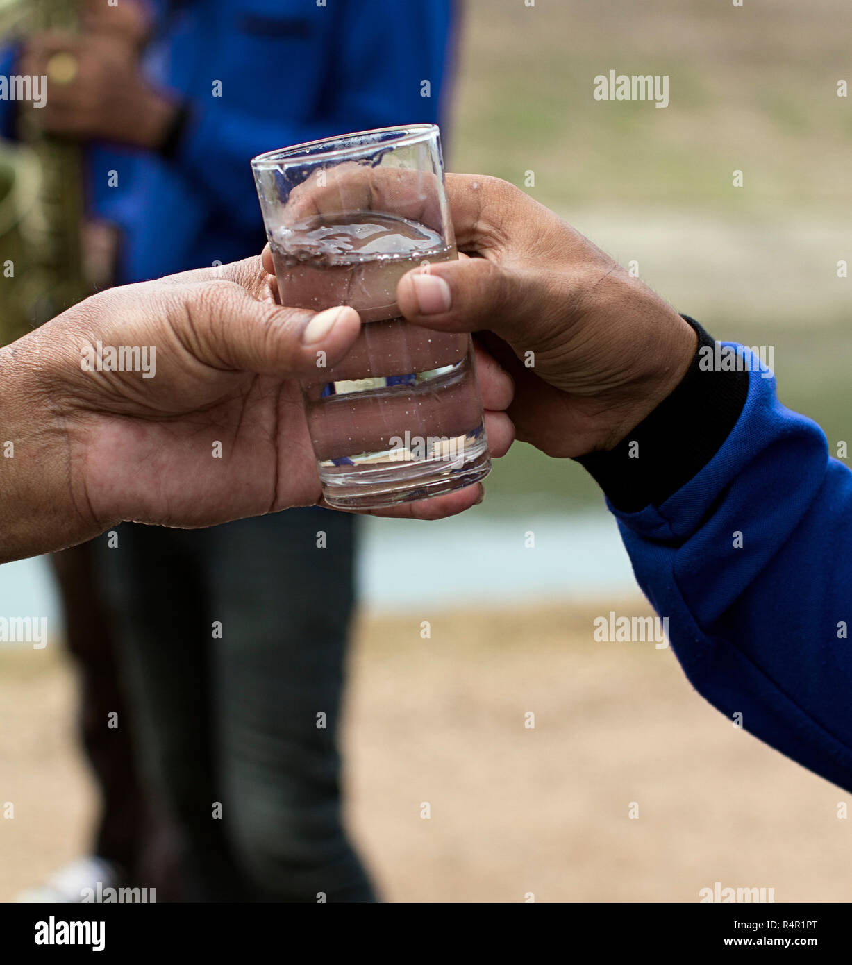 hand glass water giving Stock Photo - Alamy