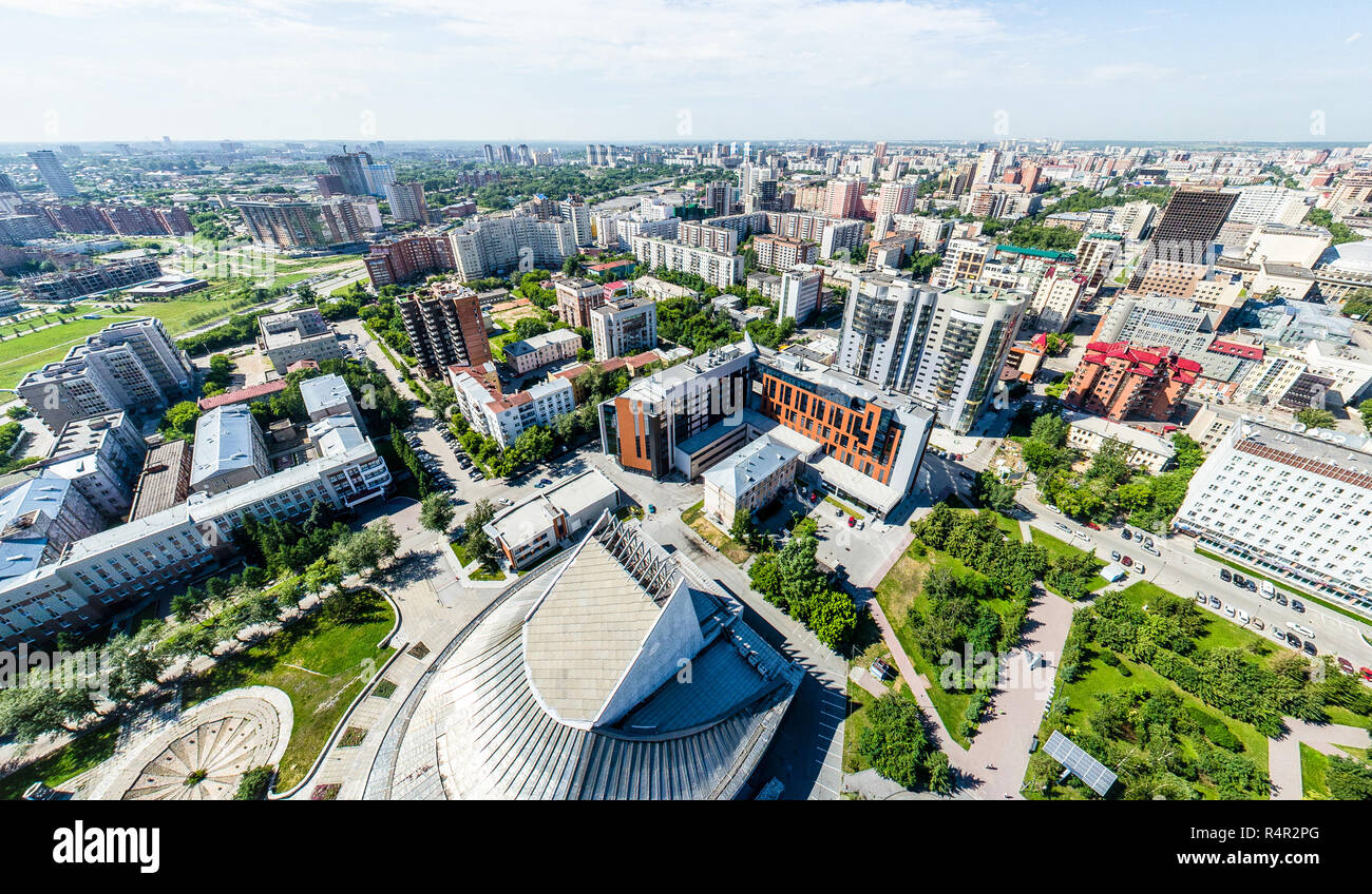 Aerial city view with crossroads, roads, houses, buildings, parks and ...