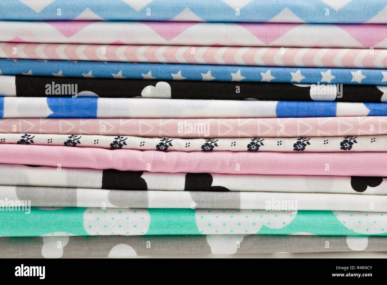 Stack of cotton fabric material background Stock Photo - Alamy