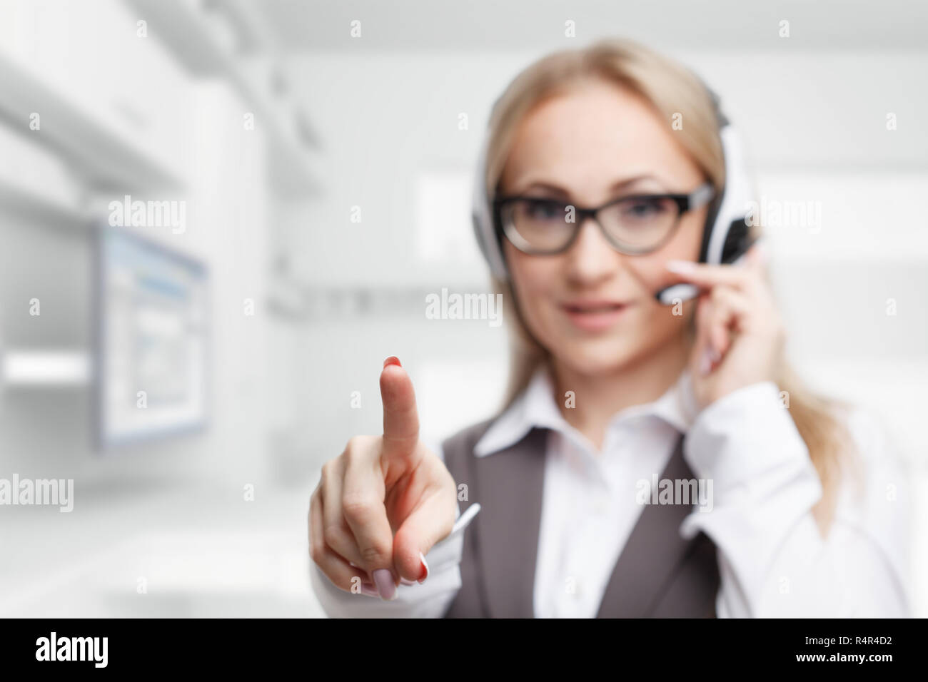 Three call center service operators at work. Portrait of smiling pretty female helpdesk employee ...