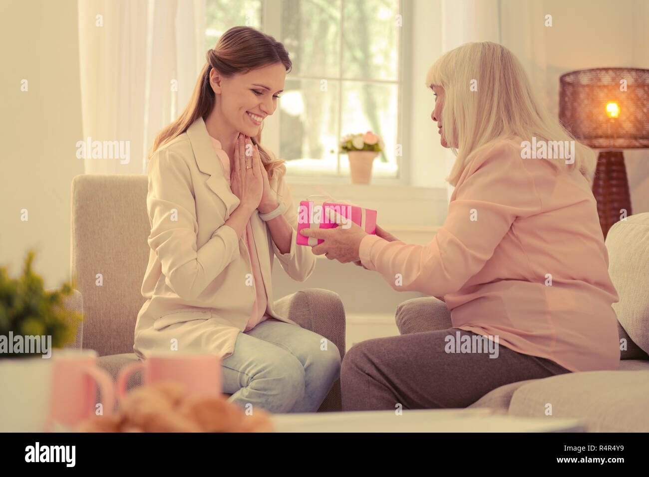 Woman with long present hi-res stock photography and images - Alamy
