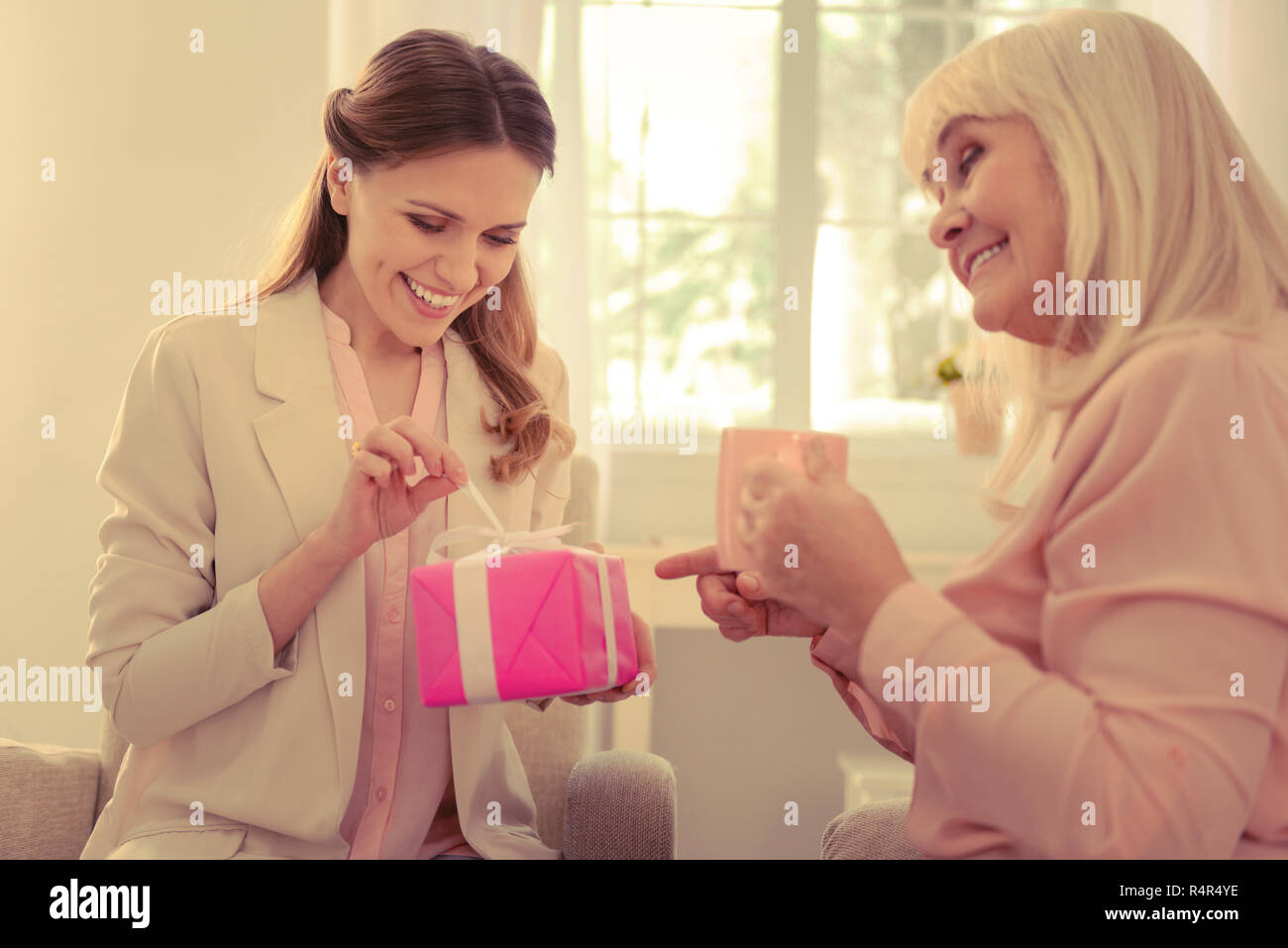 Woman with long present hi-res stock photography and images - Alamy