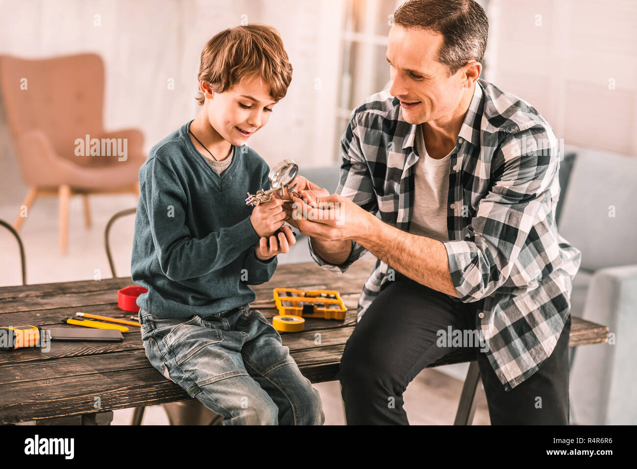 Responsible dad teaching his kid the fun of little things Stock Photo ...