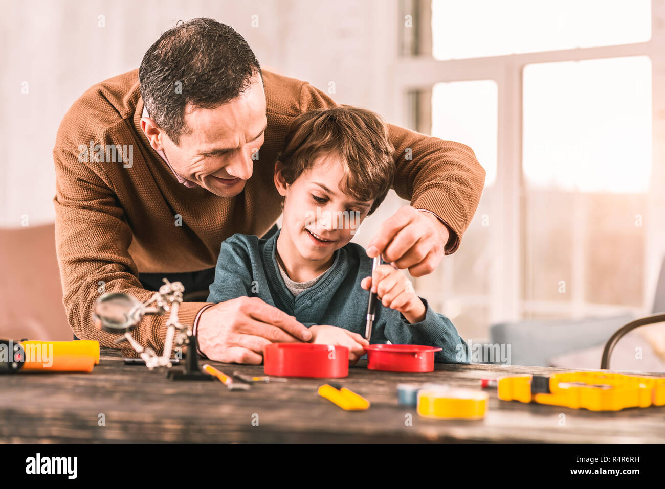 Caring dad looking after his son's route to success Stock Photo - Alamy