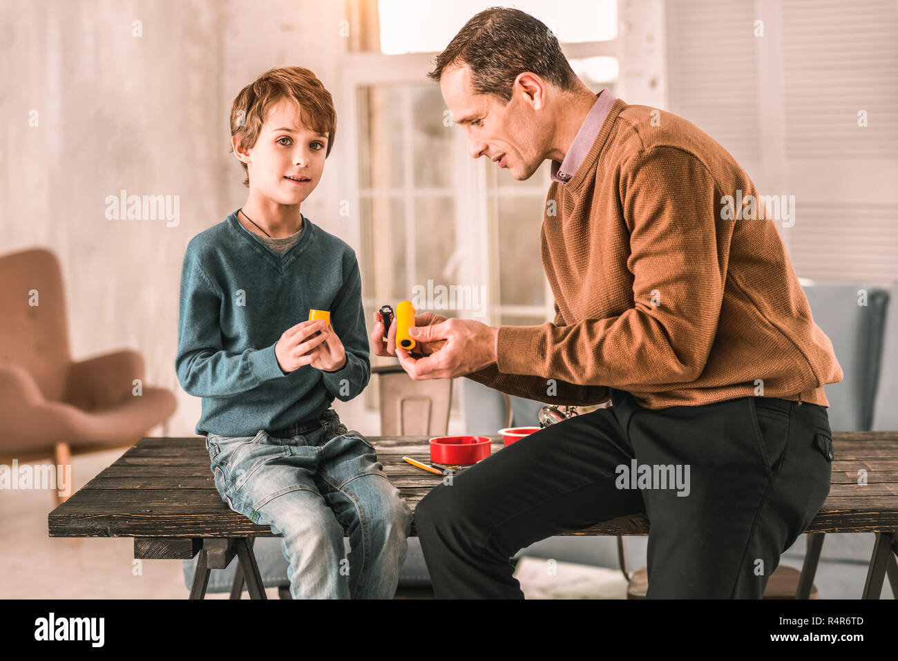Cute focused child getting distracted from his work for a second Stock ...