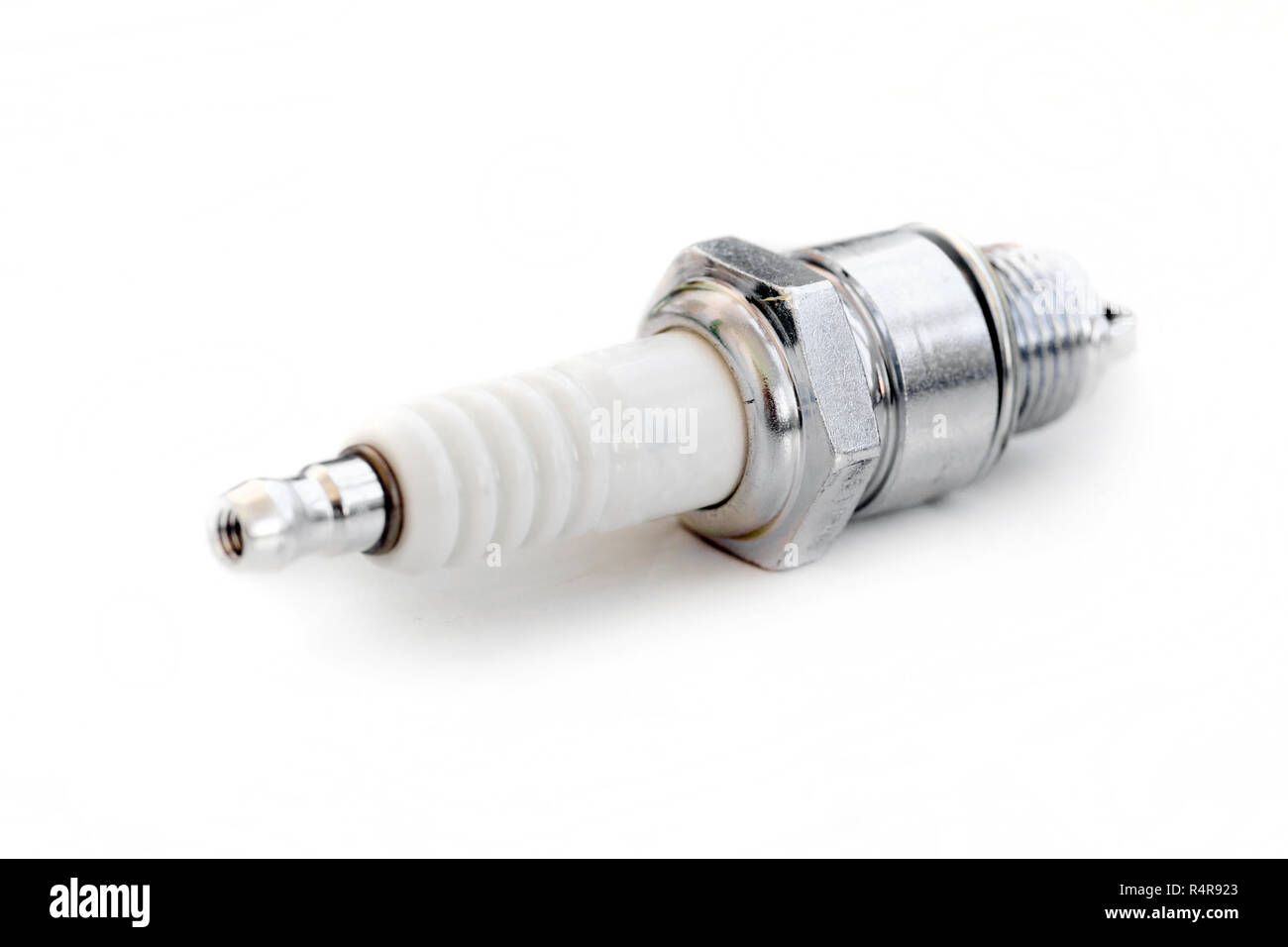 Spark plug on white Stock Photo - Alamy