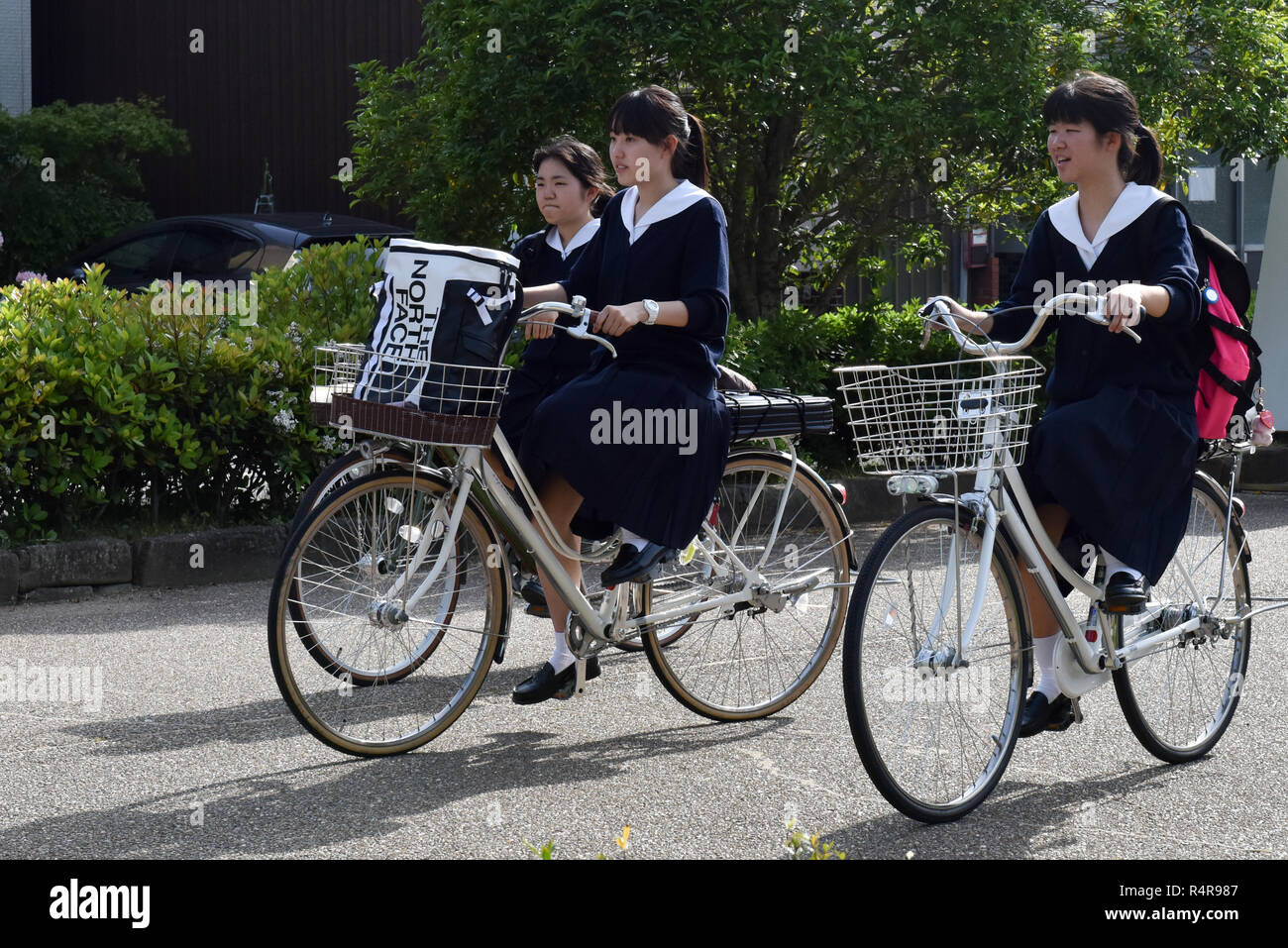 Schoolgirls with bicycles hi-res stock photography and images - Alamy