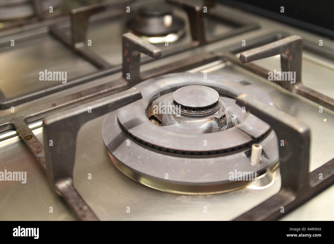 Used gas kitchen stove Stock Photo - Alamy