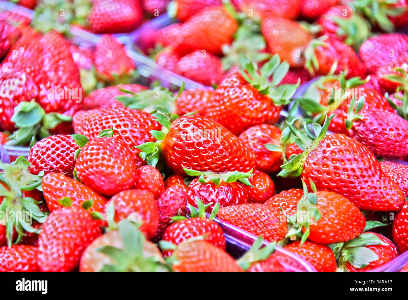 Fresh strawberries on street market stall Stock Photo - Alamy