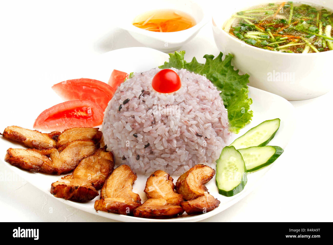 Vietnamese lunch set of rice with fried pork and soup Stock Photo - Alamy