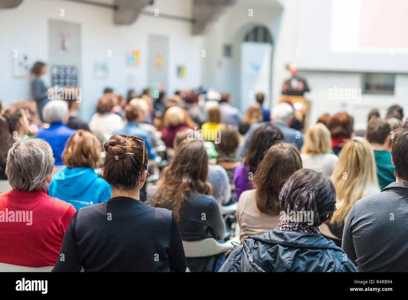 Man giving presentation in lecture hall at university Stock Photo - Alamy