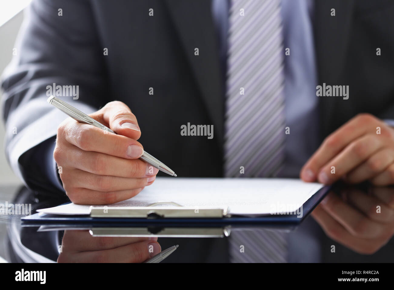 Male arm in suit and tie fill form clipped Stock Photo - Alamy