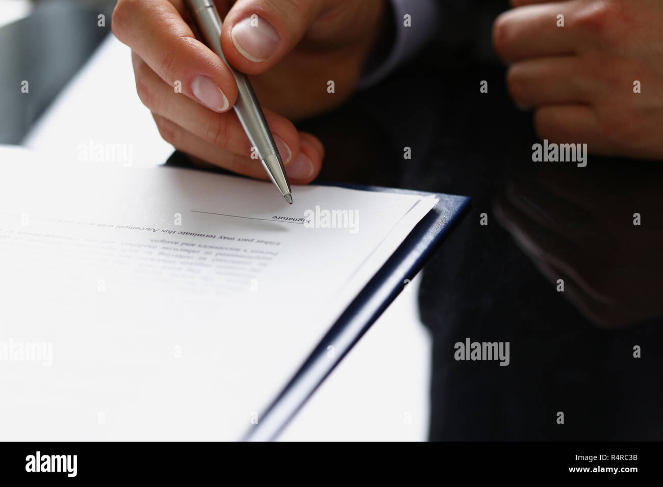 Male arm in suit and tie fill form clipped Stock Photo - Alamy