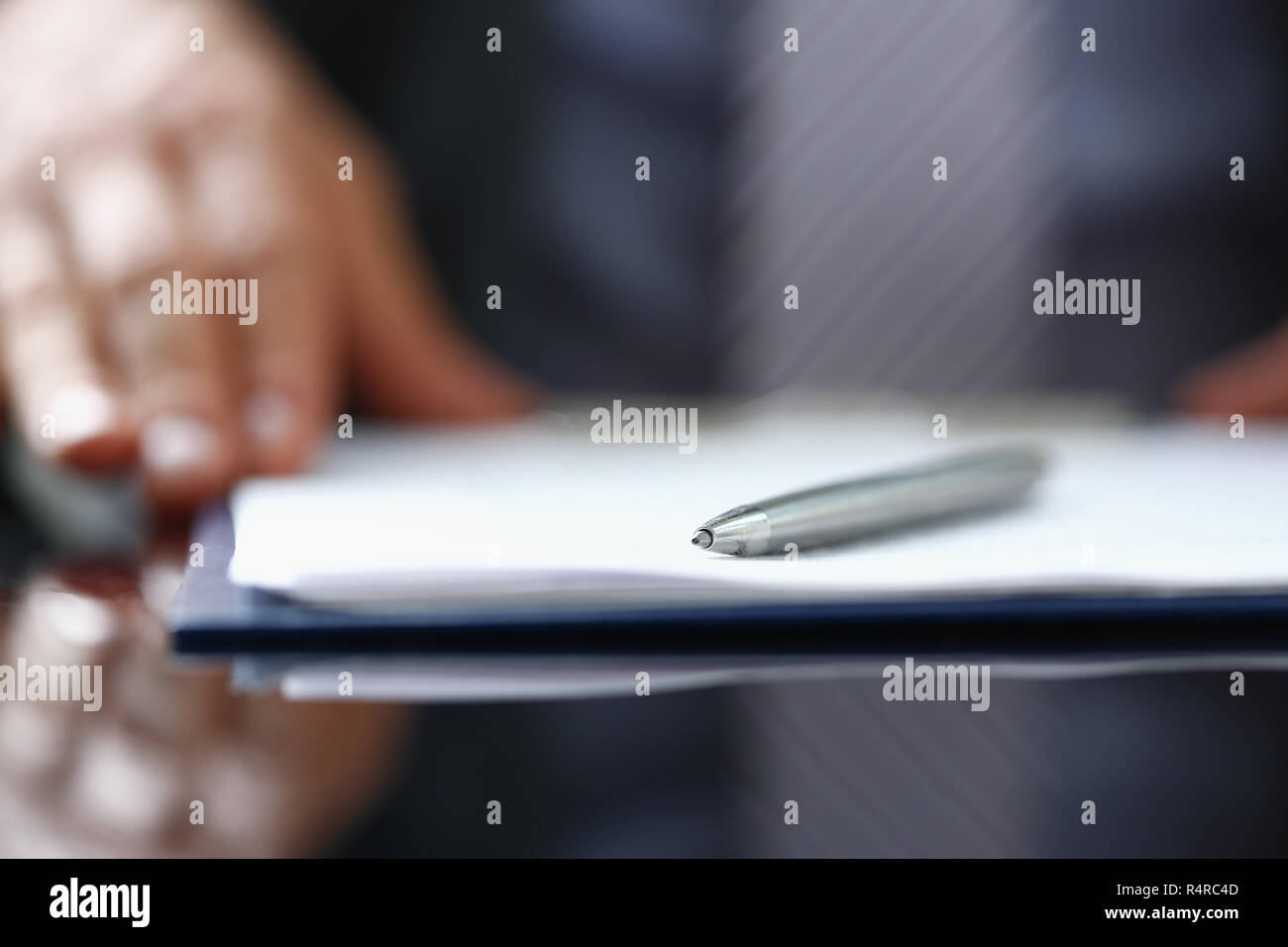 Male arm in suit offer contract form on Stock Photo - Alamy