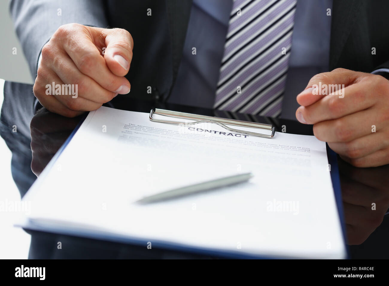 Male arm in suit offer contract form on Stock Photo - Alamy