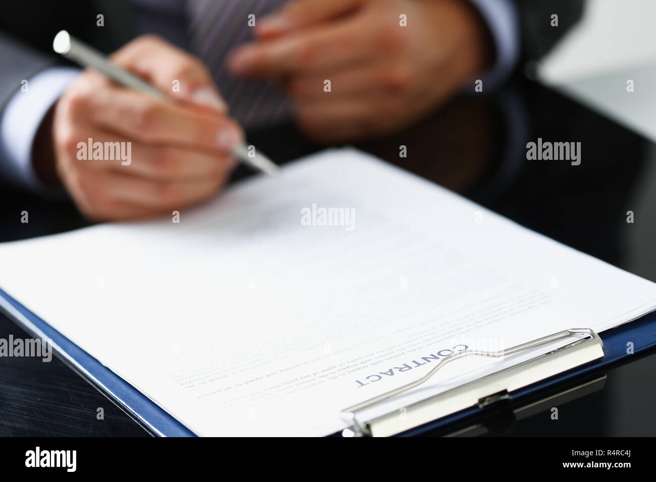 Male arm in suit and tie fill form clipped Stock Photo - Alamy