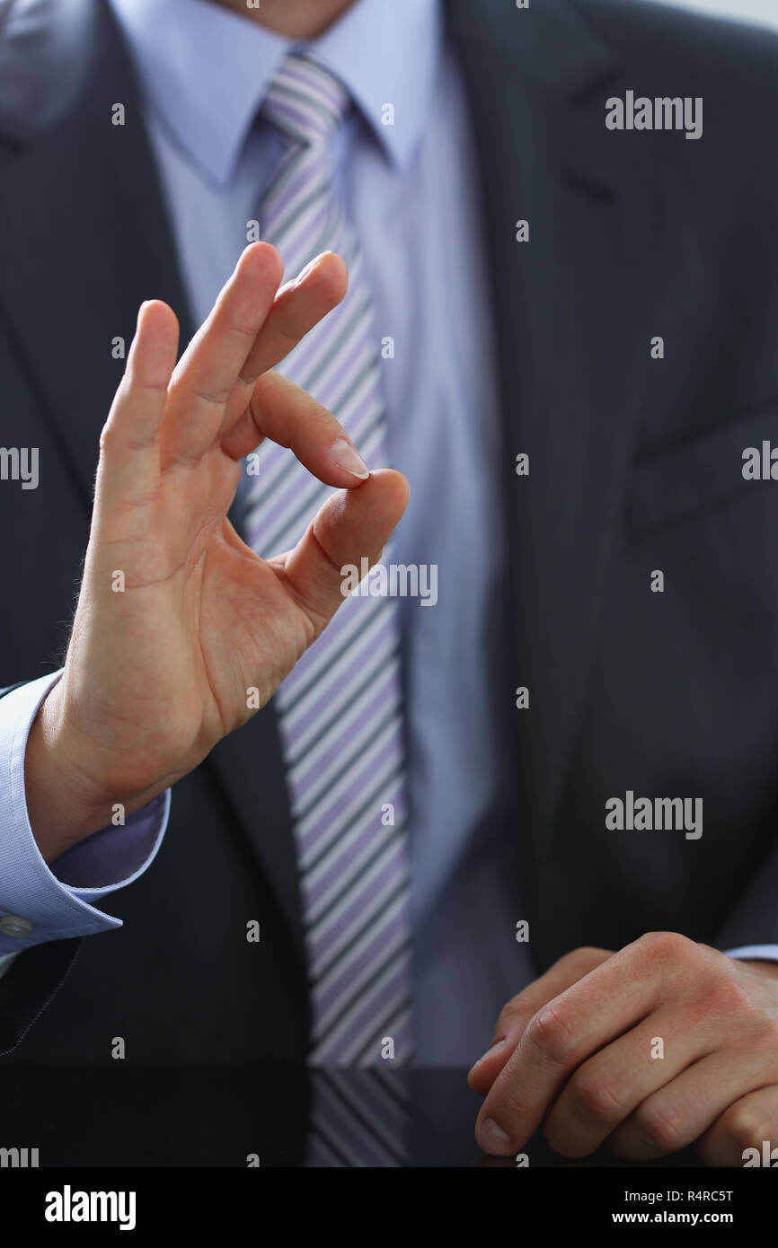 Male hand showing OK or confirm sign with Stock Photo - Alamy
