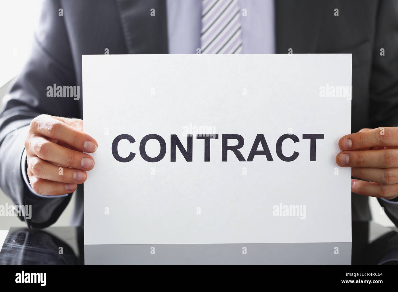 Business man hold contract hi-res stock photography and images - Alamy