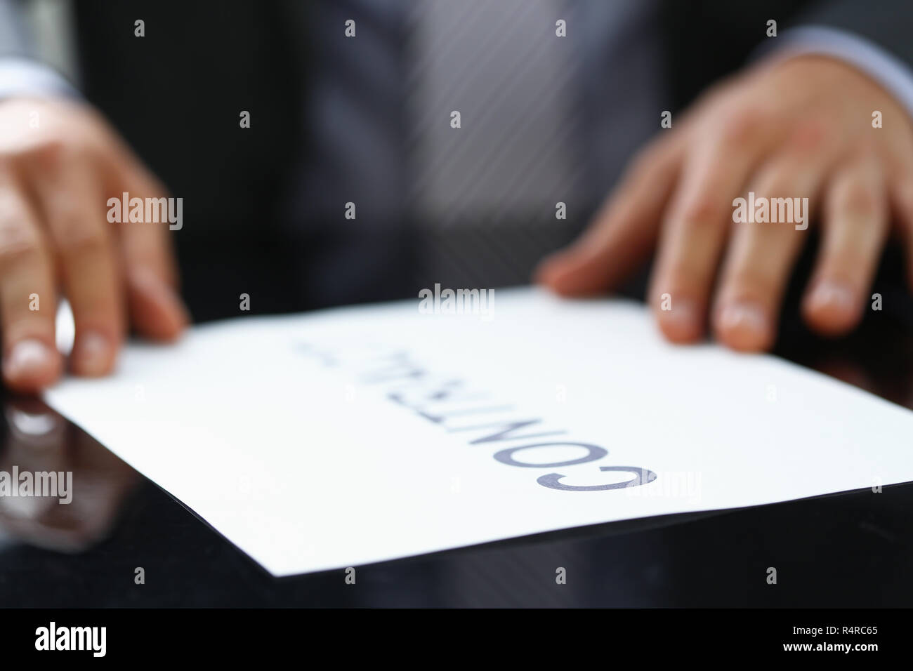 Business man hold contract hi-res stock photography and images - Alamy