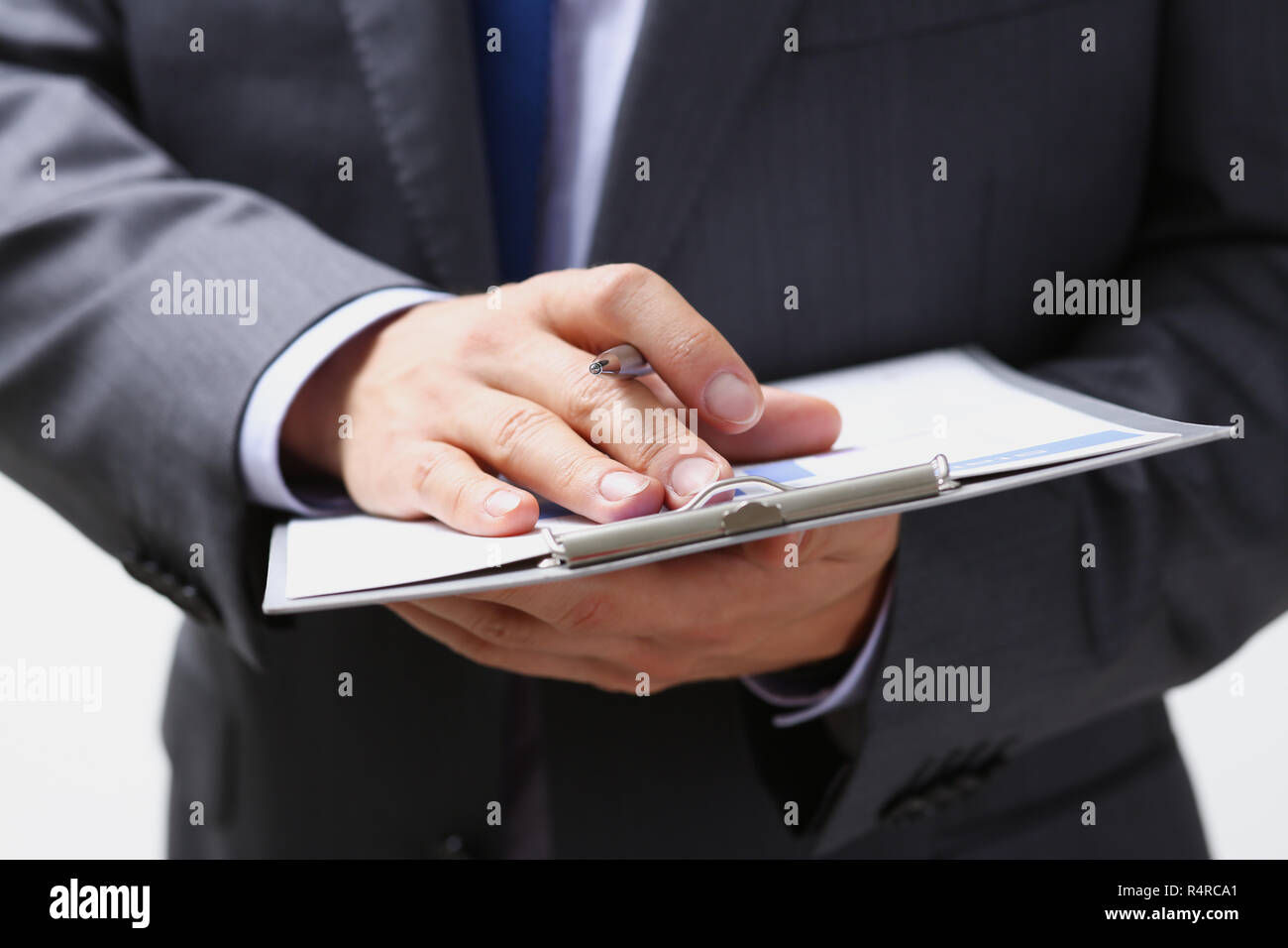 Male arm in suit and tie fill form clipped Stock Photo - Alamy