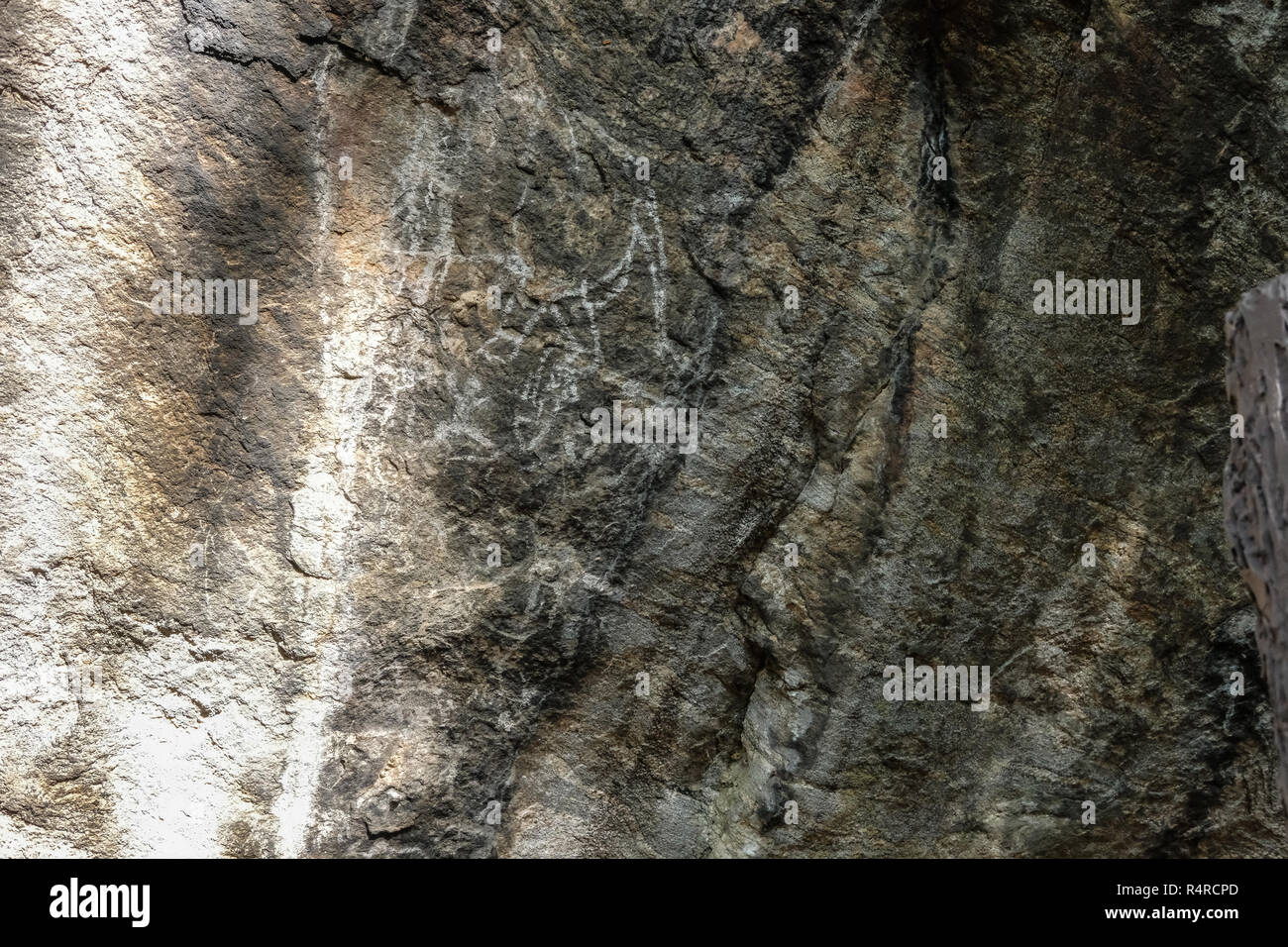 ancient petroglyph drawing on rock at Obluang national park in Chiang ...