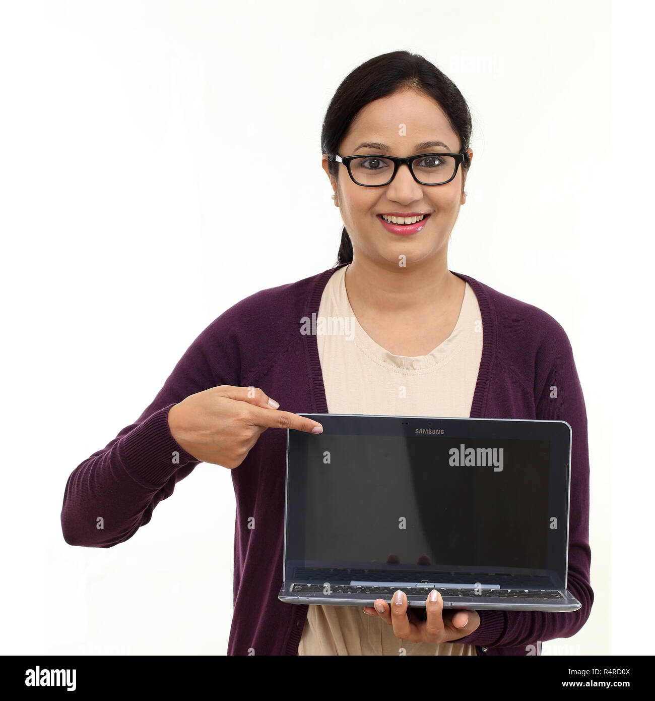Young happy Woman holding a laptop Over white background Stock Photo ...