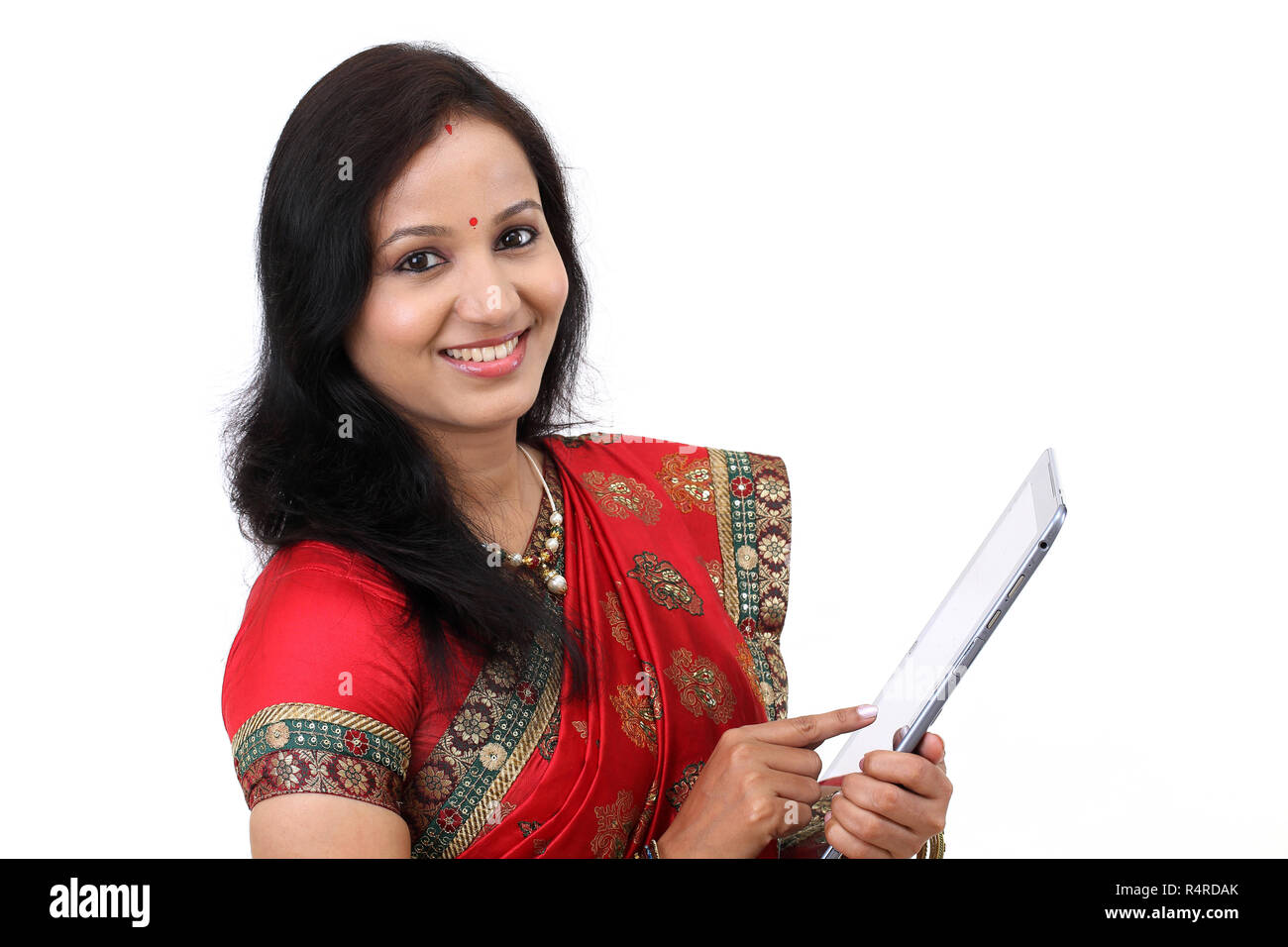 Traditional Indian woman holding a laptop computer Stock Photo - Alamy