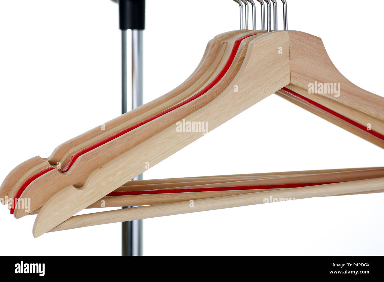 Red and wooden hanger hanging on metal Stock Photo - Alamy