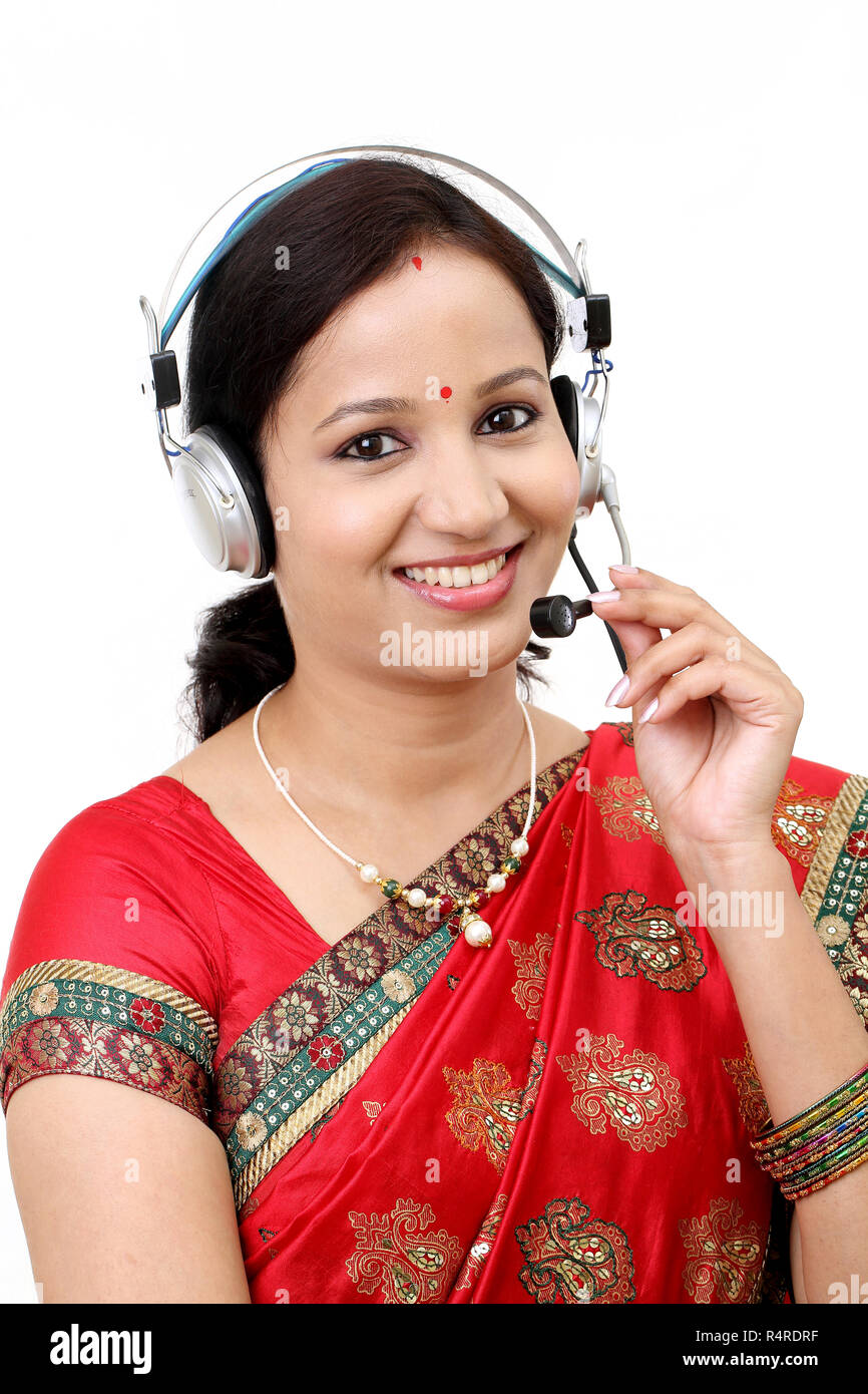 Happy young traditional woman wearing headset Stock Photo - Alamy