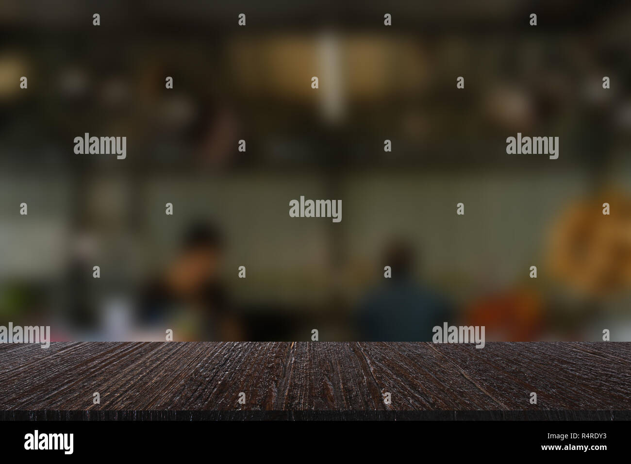 people cooking food in restaurant kitchen. blur background with wood ...