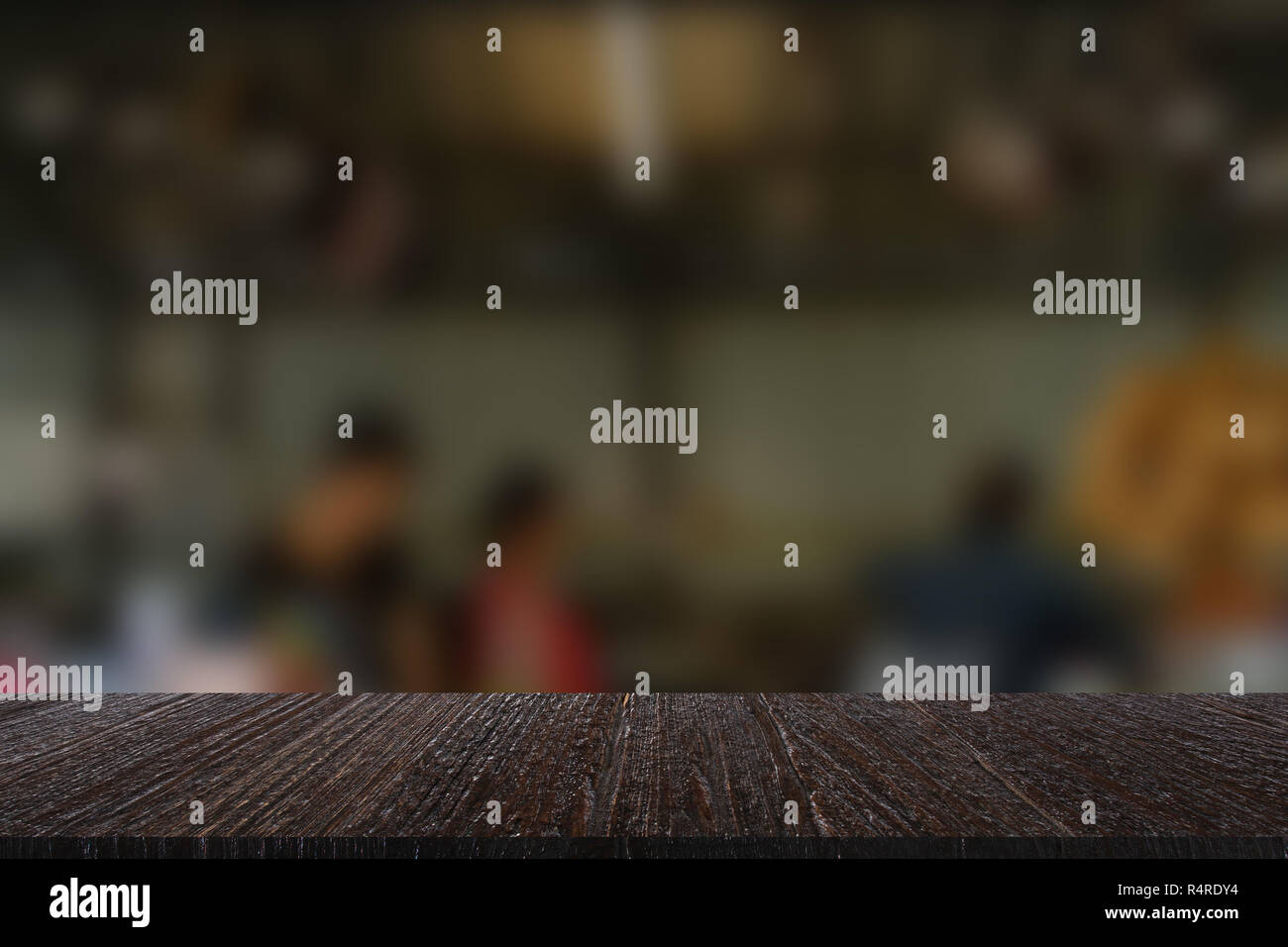 people cooking food in restaurant kitchen. blur background with wood ...