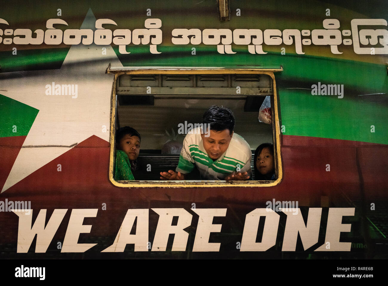 Passengers on board a train at the Mandalay Railway Station, Mandalay ...