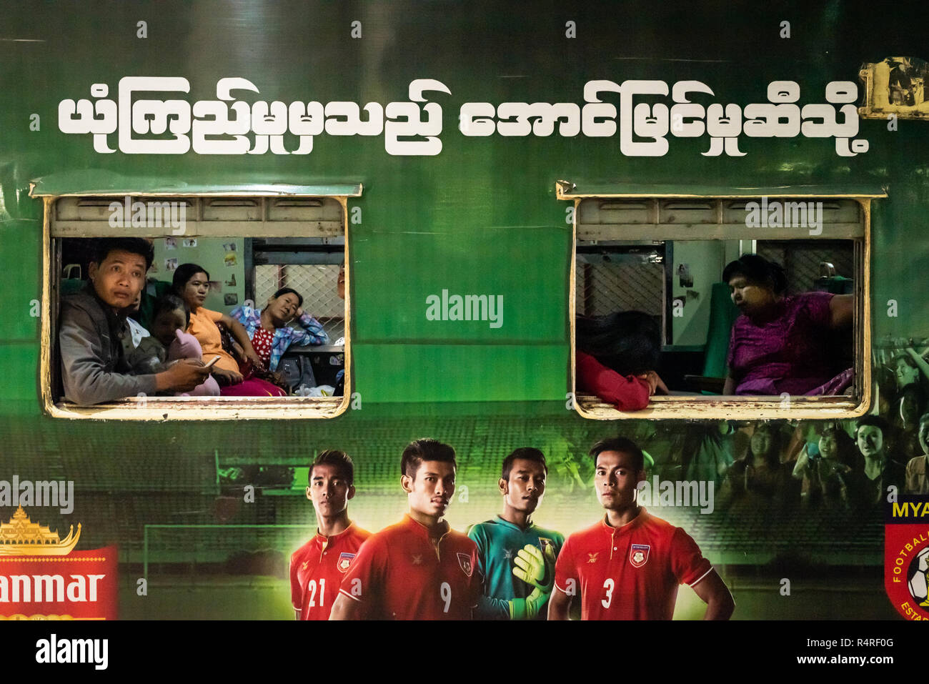 Passengers on board a train at the Mandalay Railway Station, Mandalay ...