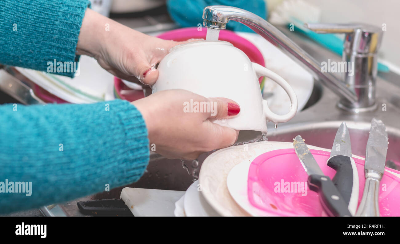Hand holding spoon full arm hi-res stock photography and images - Alamy