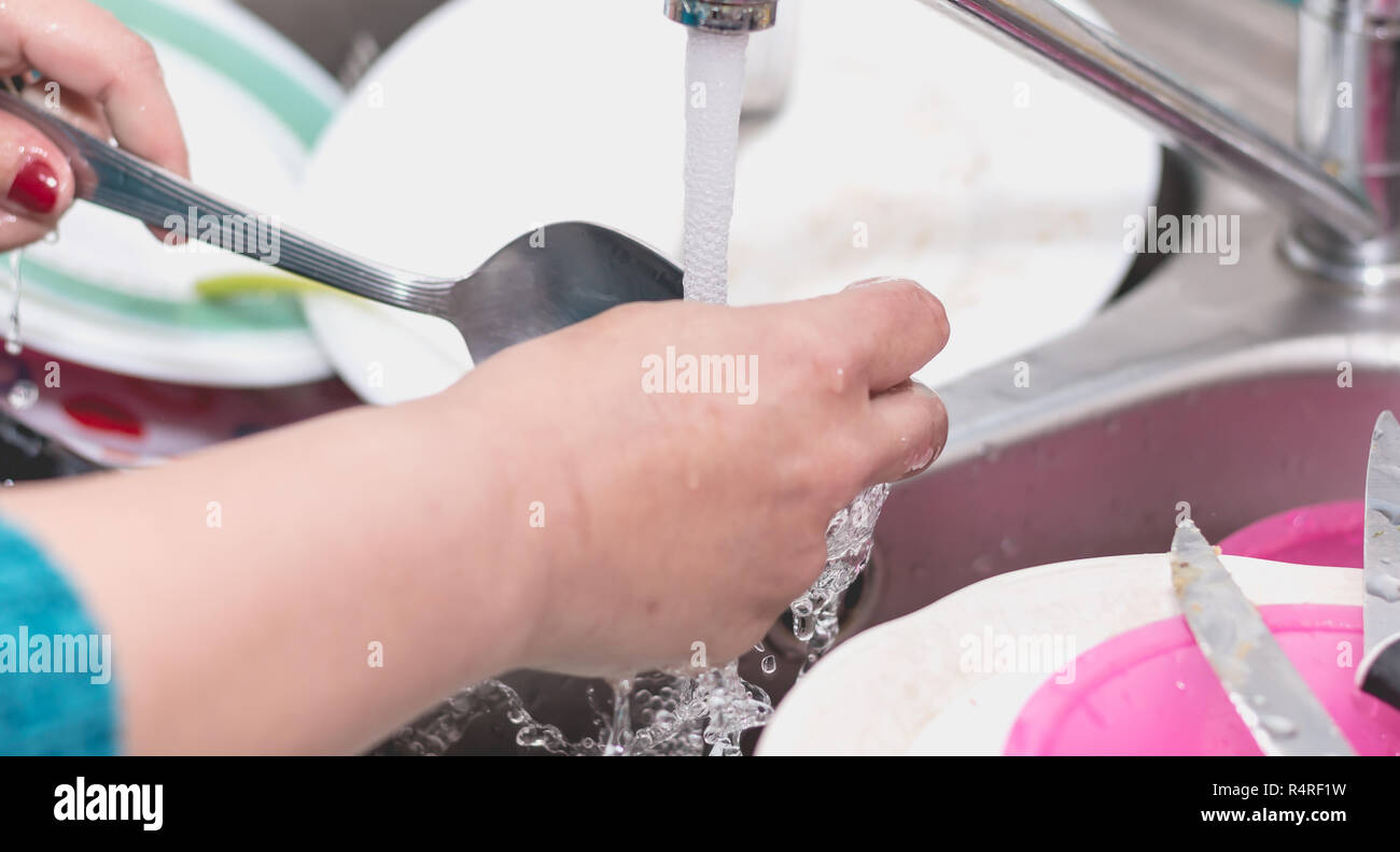 Hand holding spoon full arm hi-res stock photography and images - Alamy