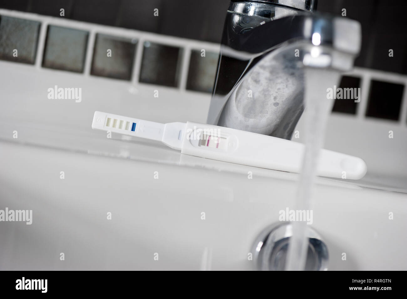closeup pregnancy test with positive pregnant (low light and shallow ...