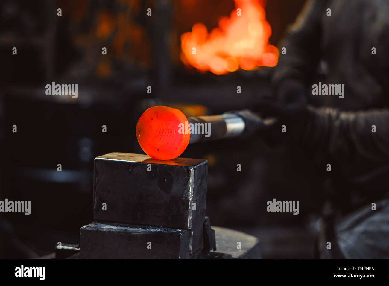 Blacksmith manually forging molten fire hi-res stock photography and ...