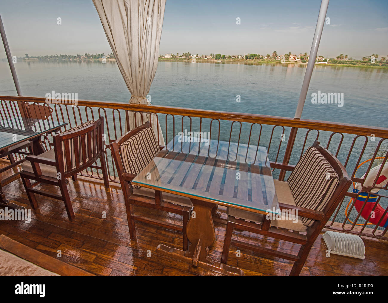 Seating chair and table on the sundeck of a nile river cruise boat with ...