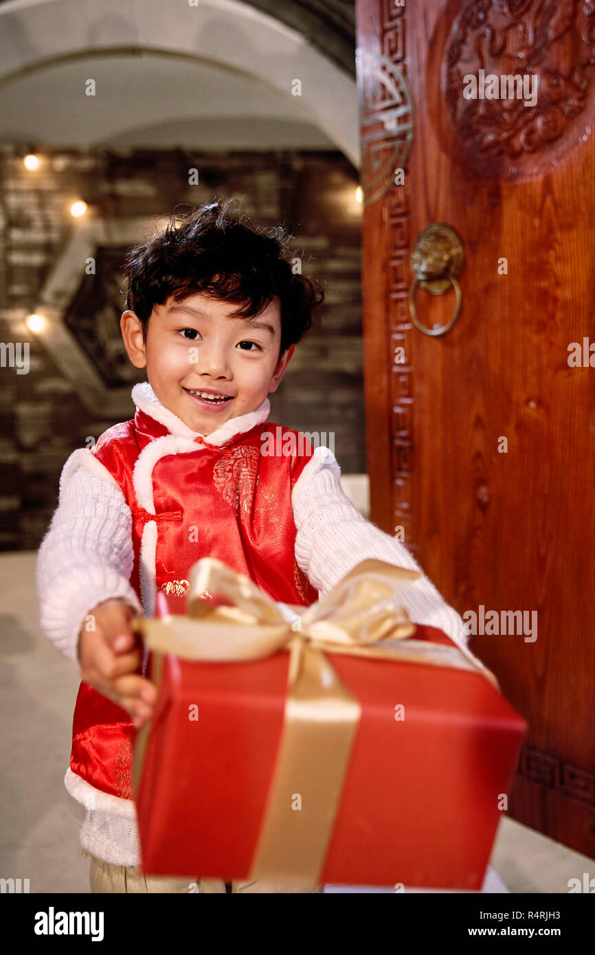 Lovely boy with a gift box Stock Photo - Alamy