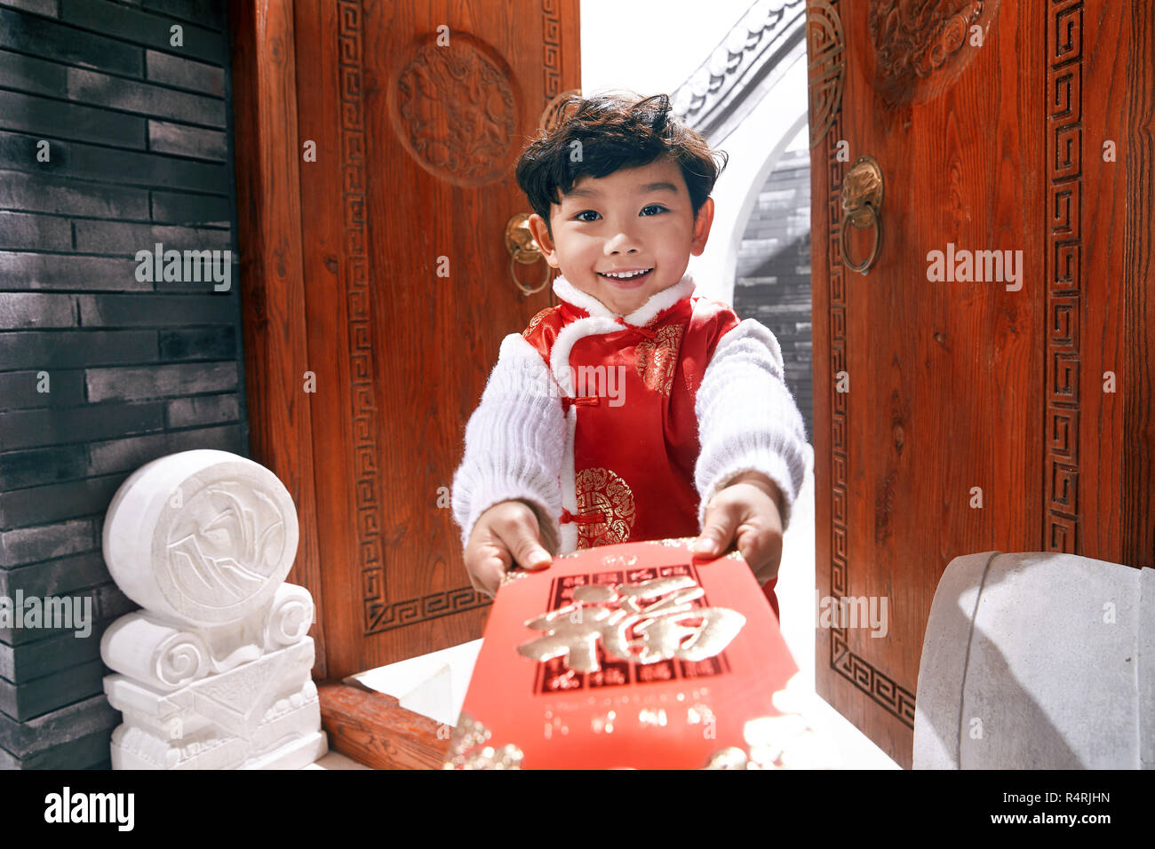 Lovely boy with a red envelope Stock Photo - Alamy